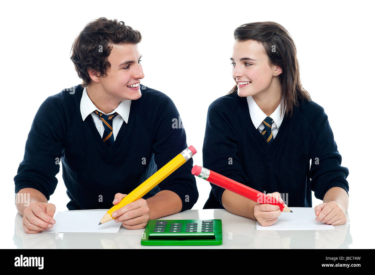 Classmates looking at each other and discussing the correct answer ...