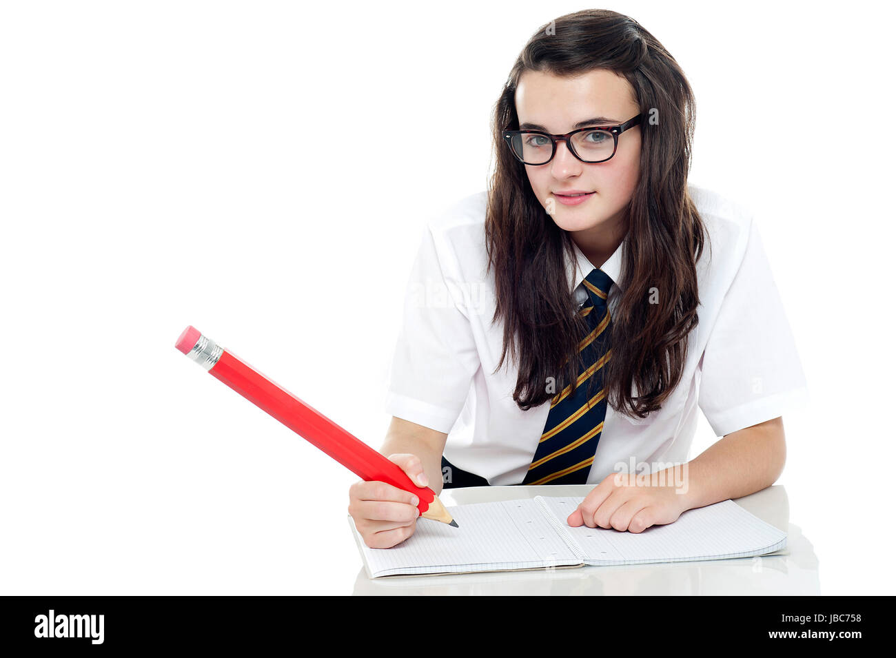 Snap shot of calm and relaxed young schoolgirl writing notes Stock ...