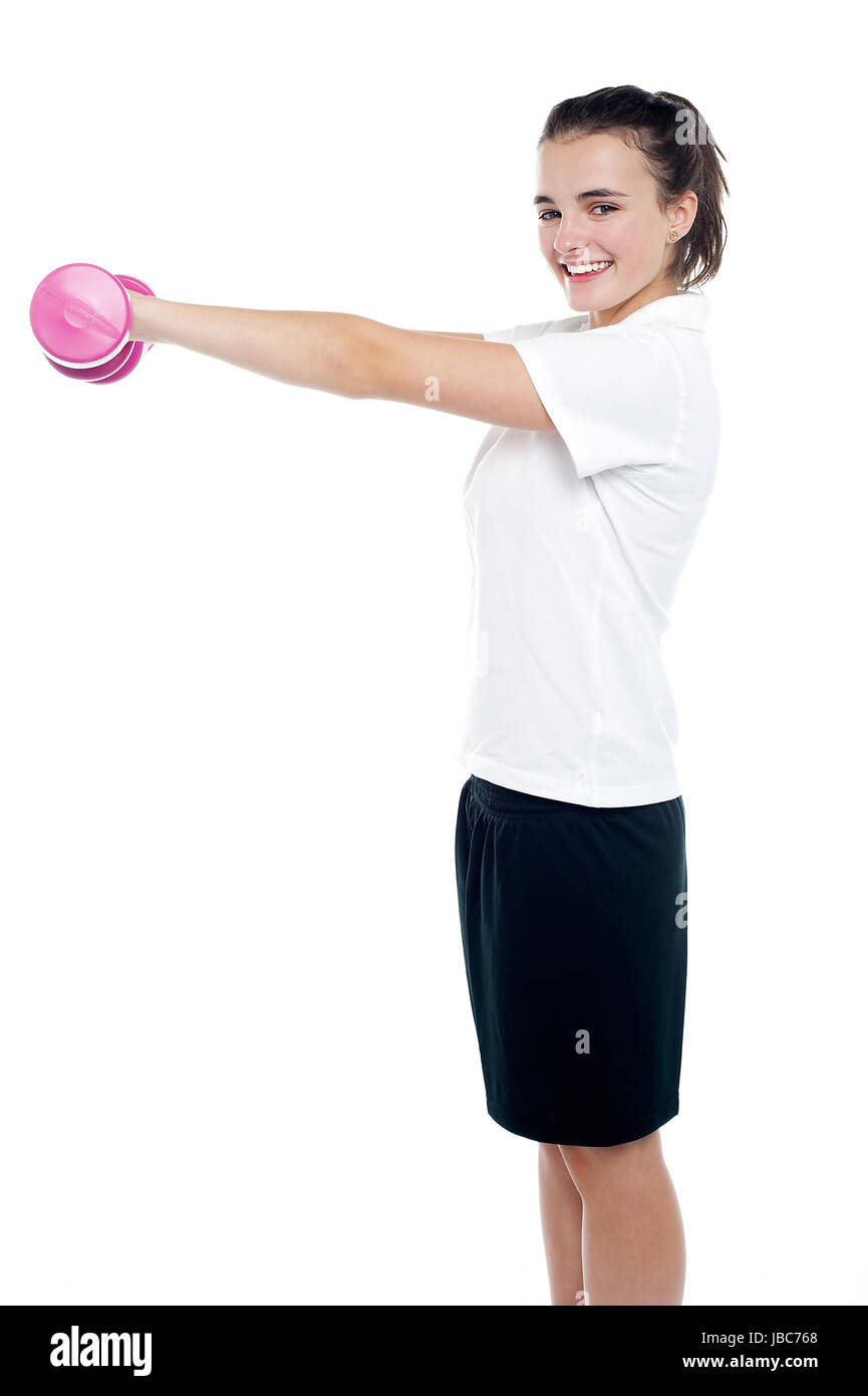 Happy fitness girl lifting dumbbells smiling cheerfully Stock Photo - Alamy