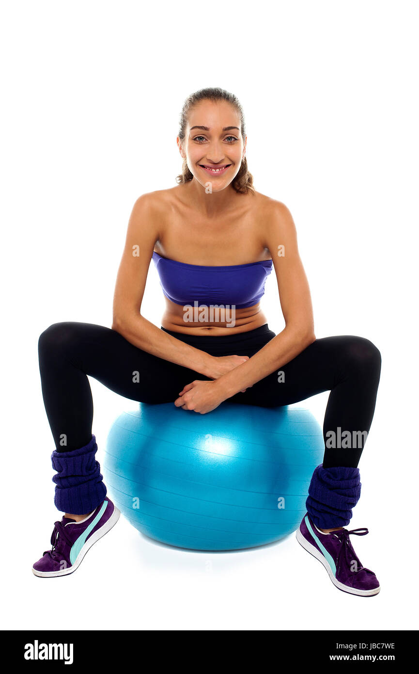 Fitness woman relaxing on big blue exercise ball Stock Photo - Alamy