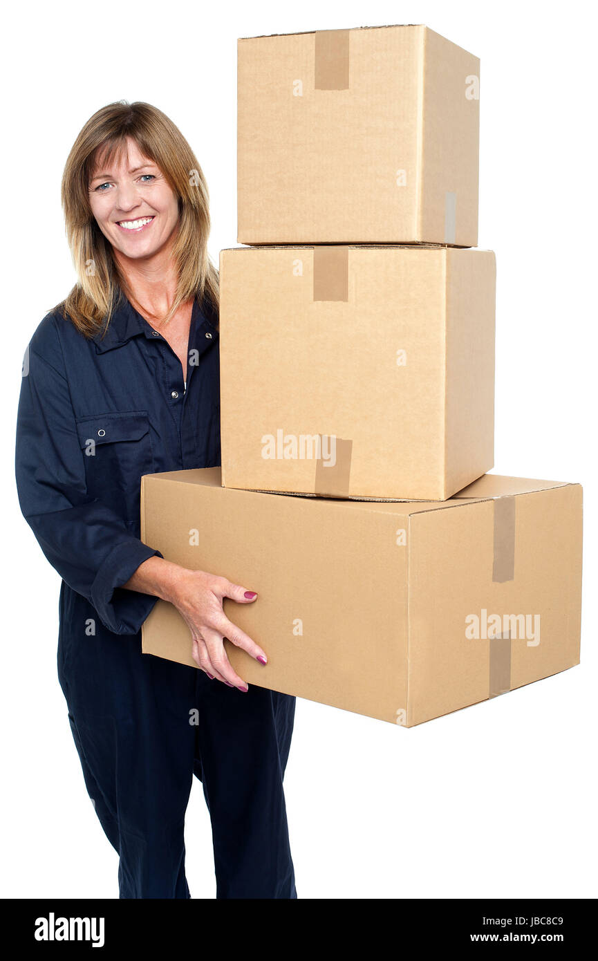 Portrait of a cheerful delivery woman in uniform posing with three ...