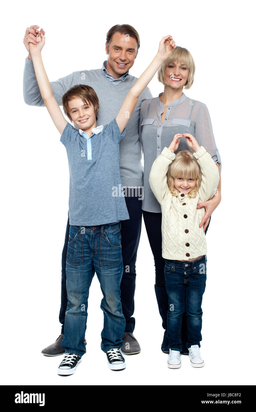 Playful kids with parents over white background, raising hands Stock ...