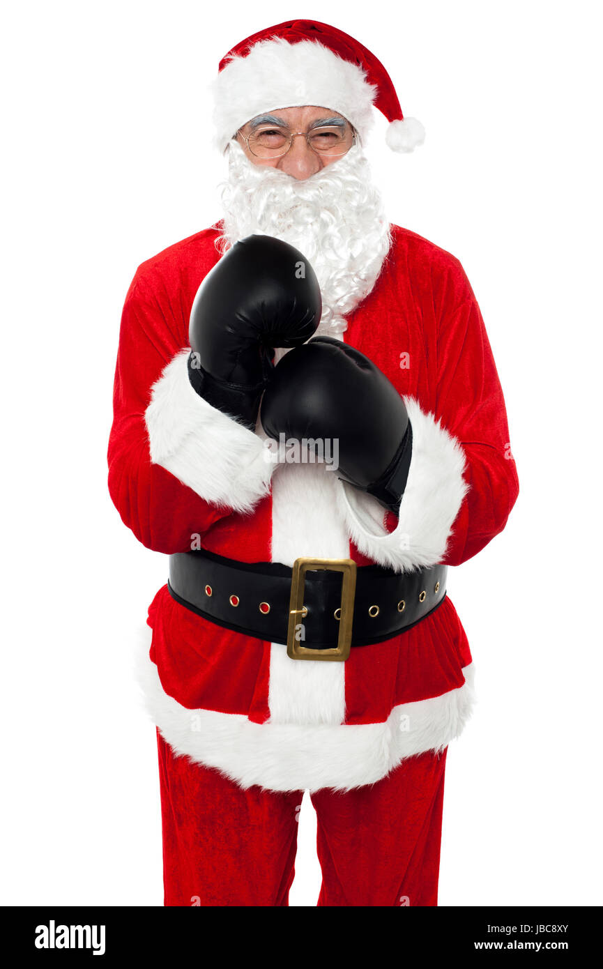 Aged cheerful Santa wearing boxing gloves, getting ready for the ...