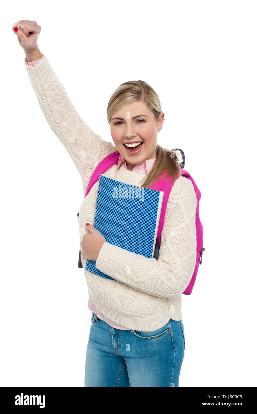Happy university student on white background raising her arm and ...