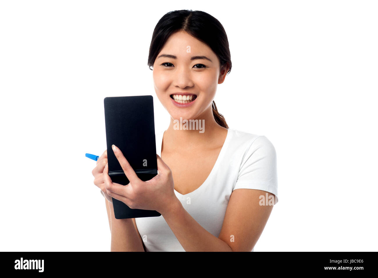 Young female personal assistant taking notes, isolated over white ...