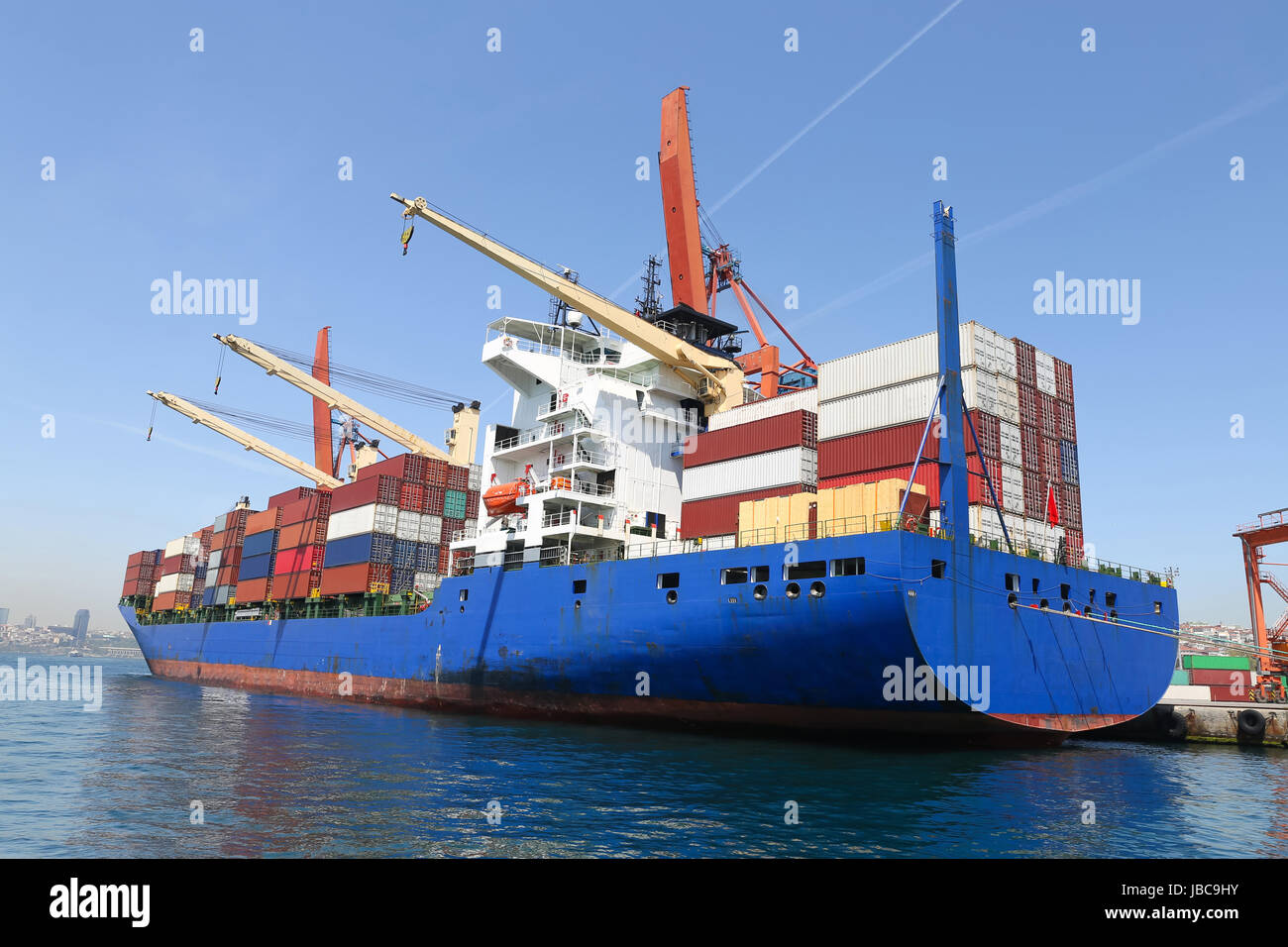 Container Ship is loading in a port Stock Photo - Alamy