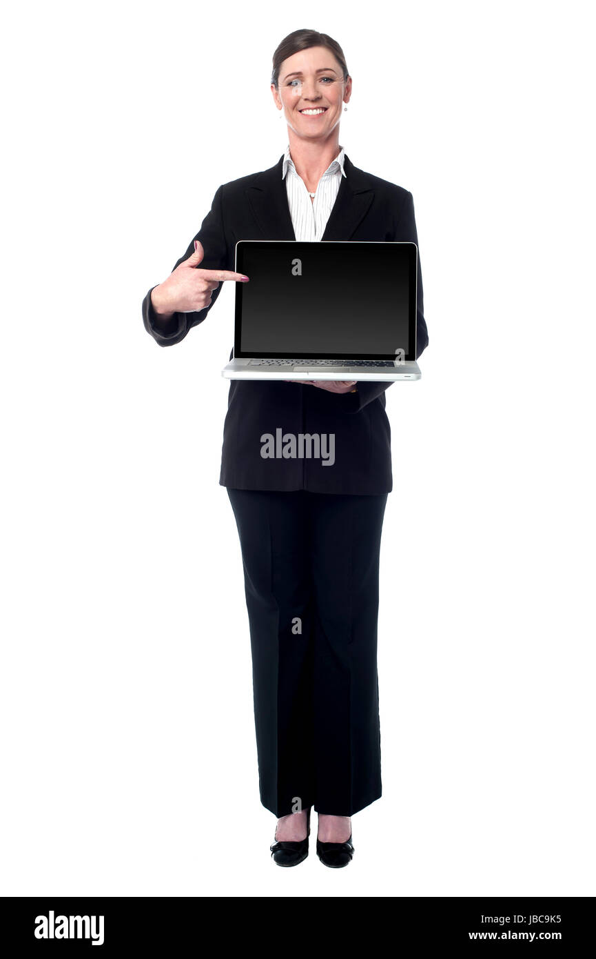 Female sales representative introducing brand new laptop Stock Photo ...