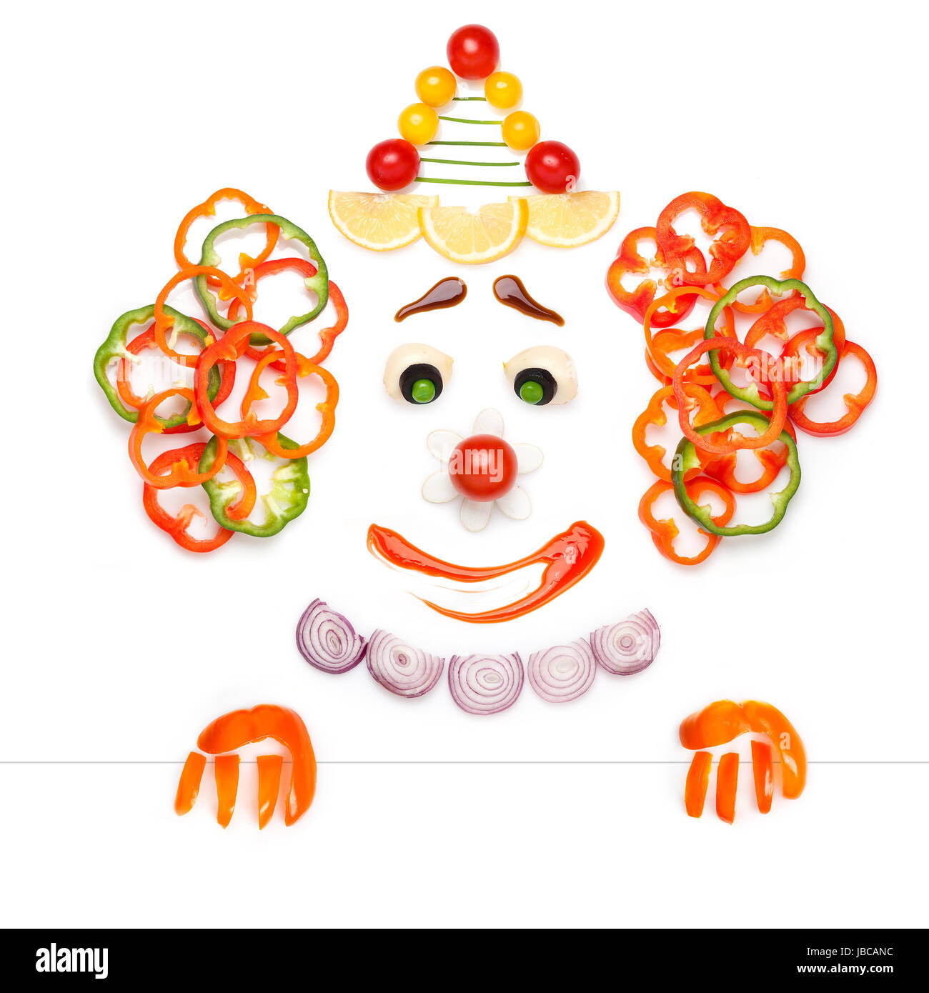 A creative food concept of a sad drama clown made of vegetables and ...