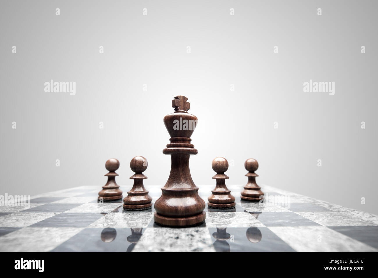 A squad of 5 chess pieces leaded by the king Stock Photo - Alamy