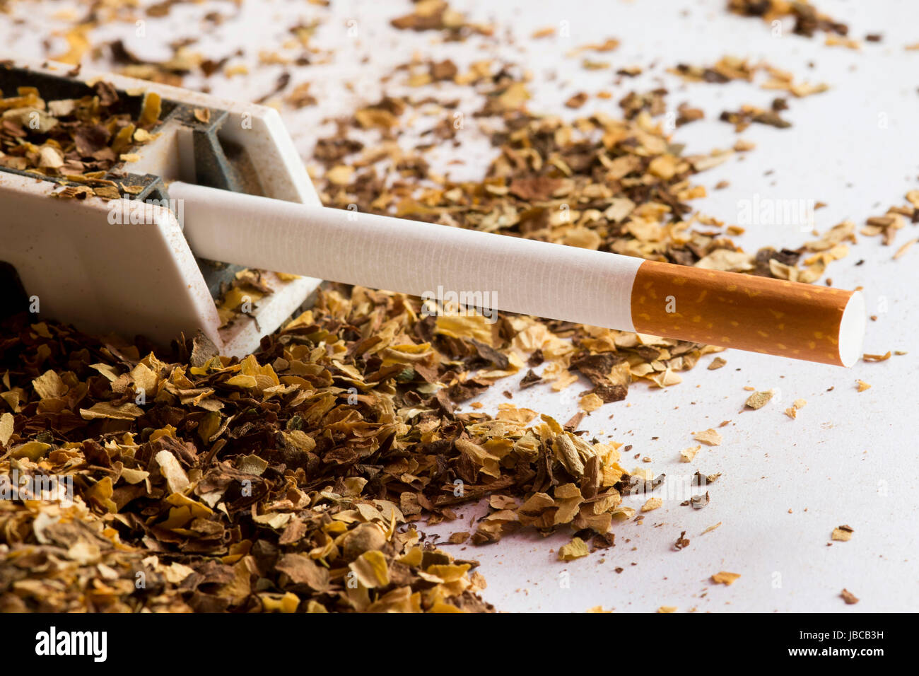 cigarette making machine and cigarette tube Stock Photo - Alamy