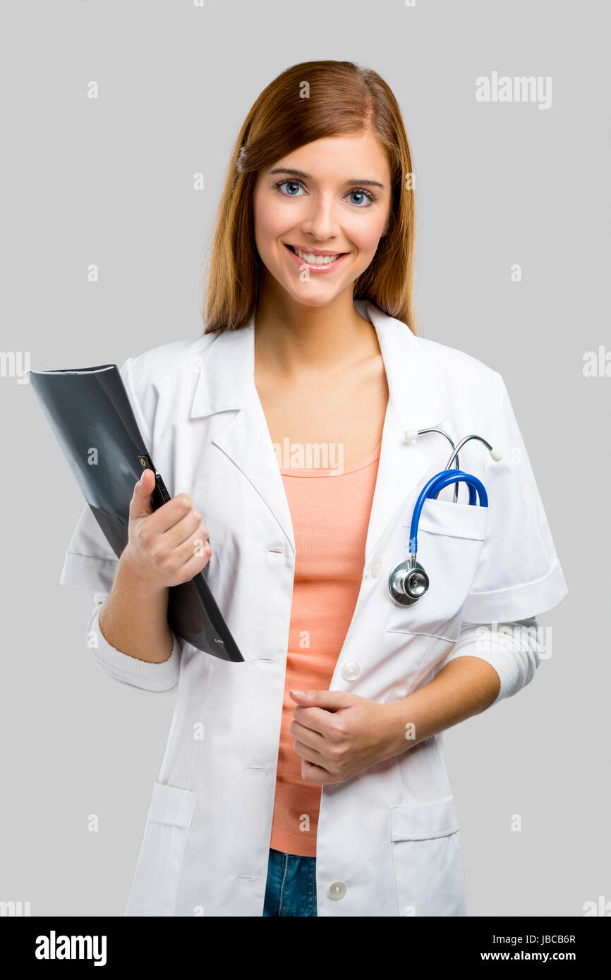 Beautiful and attractive female doctor, isolated over a white ...