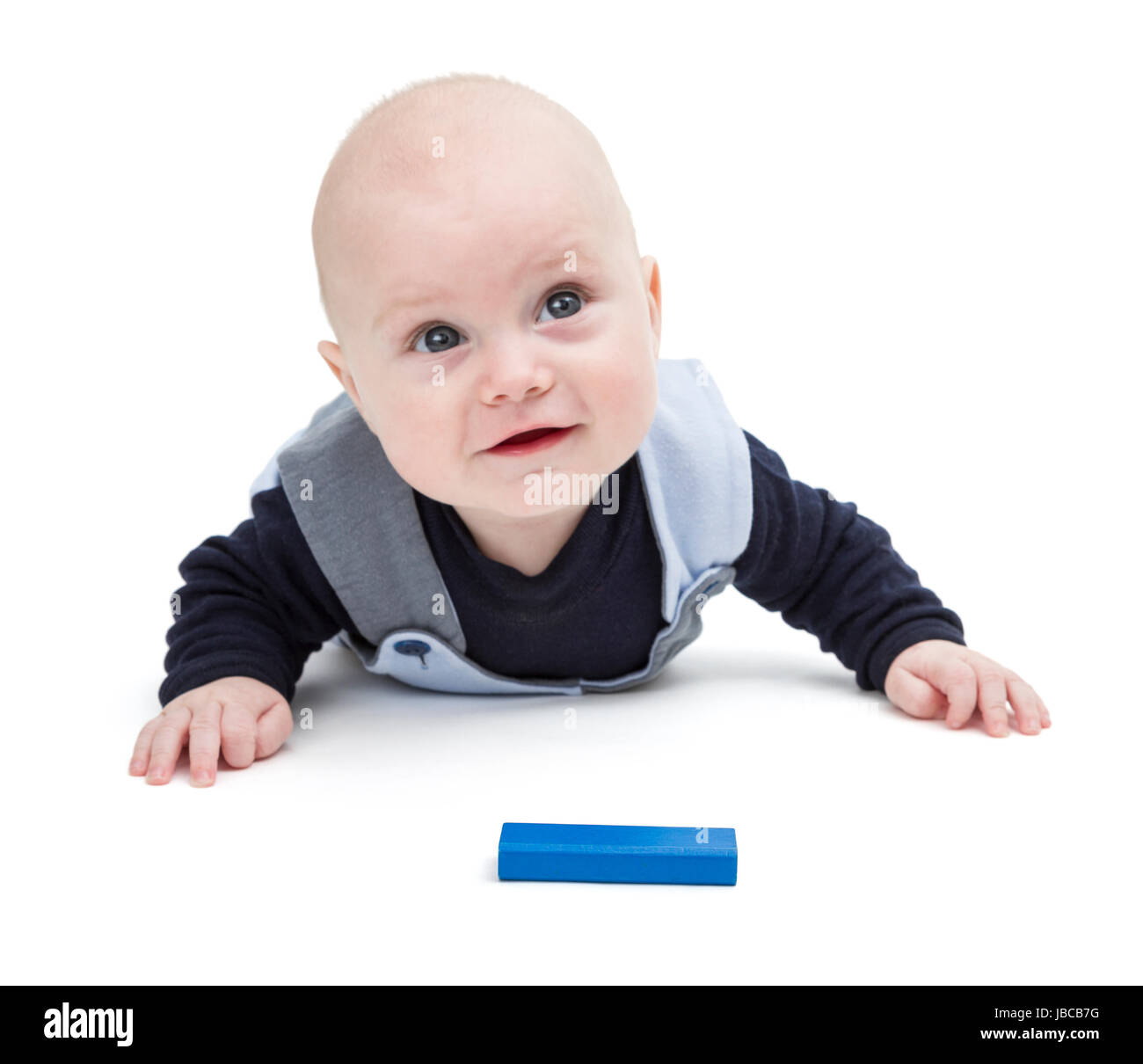 interested baby with toy block on floor isolated on white Stock Photo ...