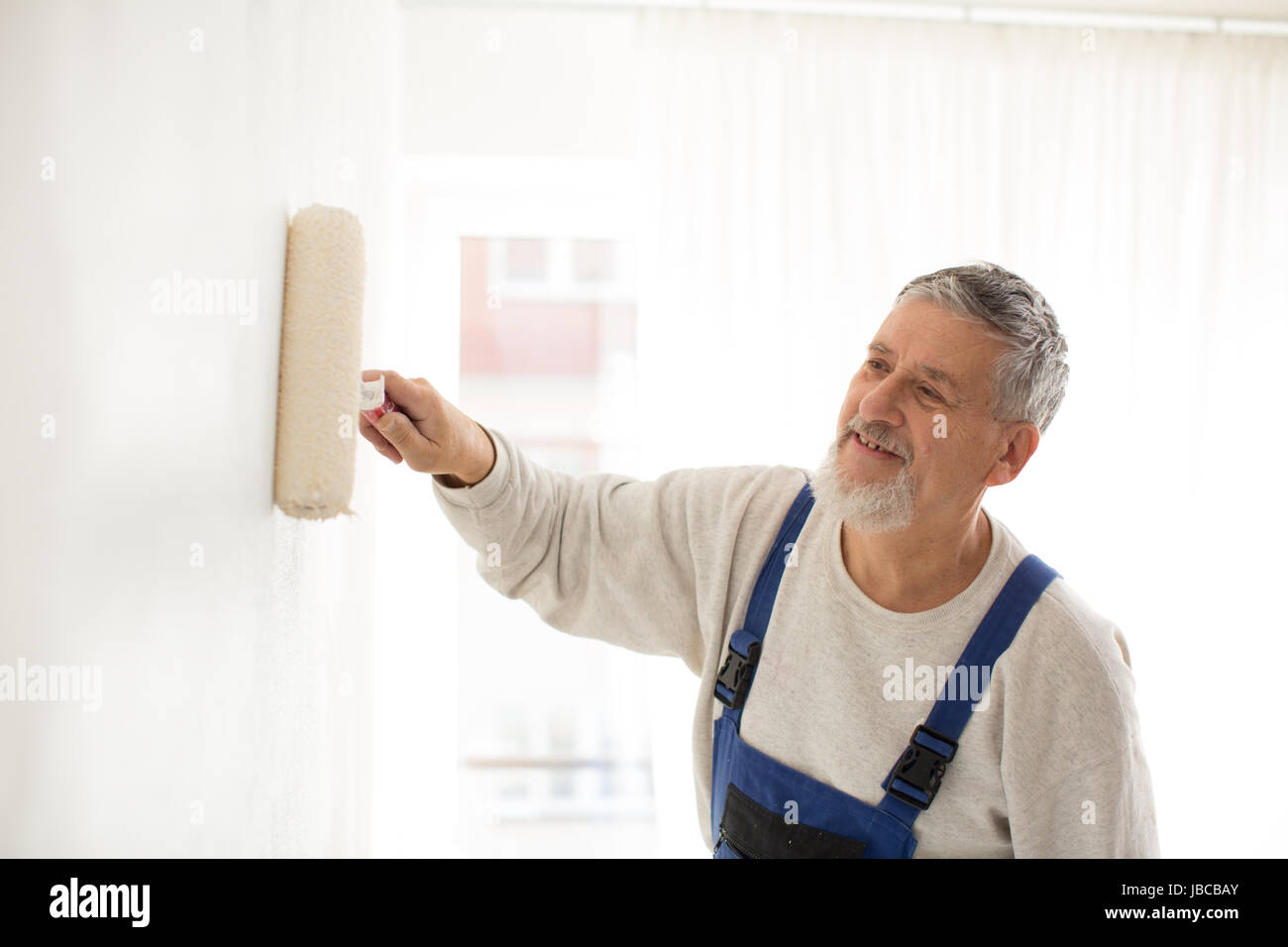 Man painting facade high rise building hi-res stock photography and ...
