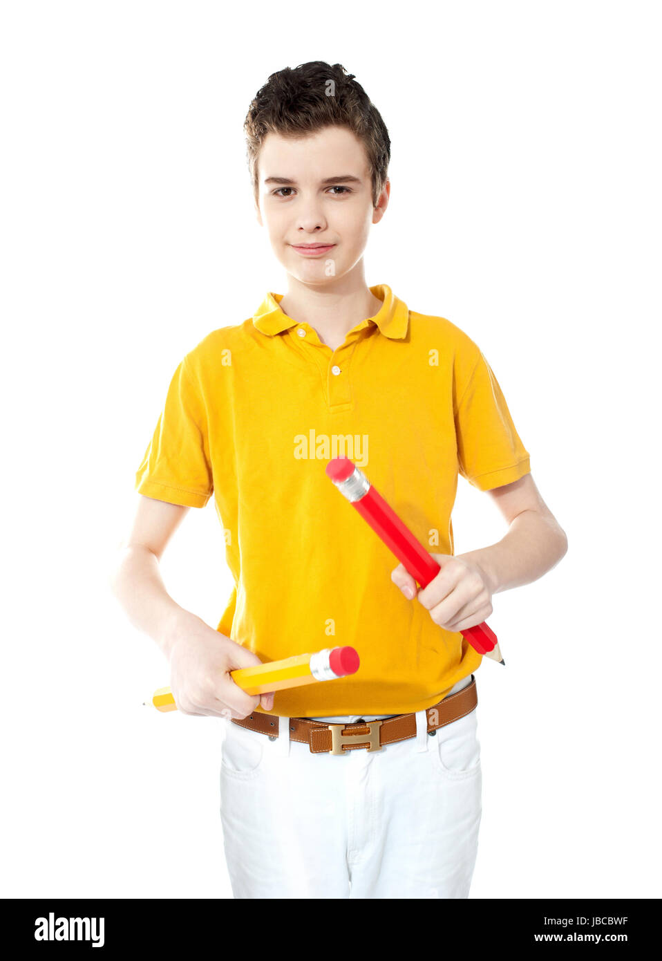 Cute young kid holding red and yellow pencils Stock Photo - Alamy