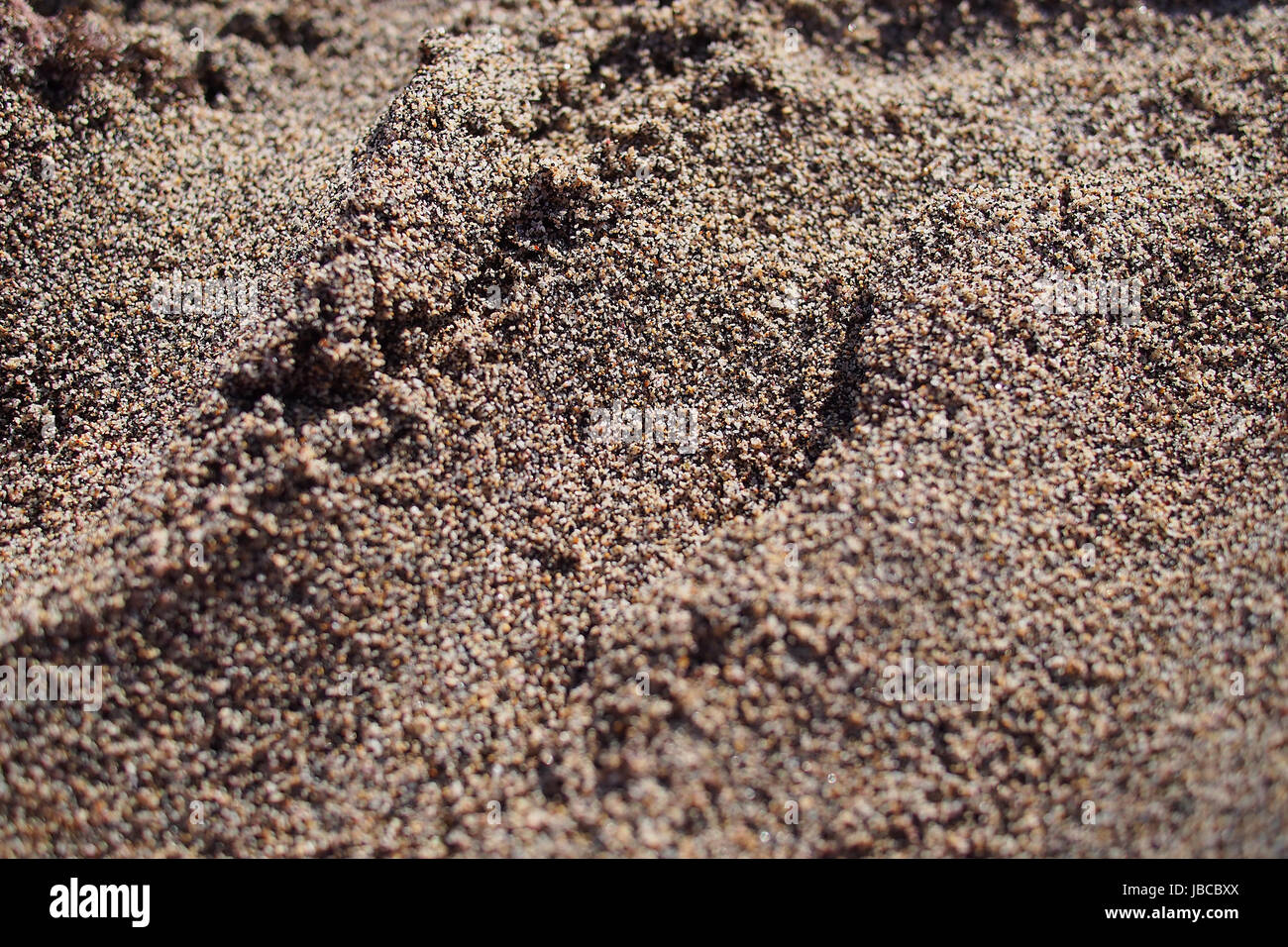 Wet sand great as background Stock Photo - Alamy