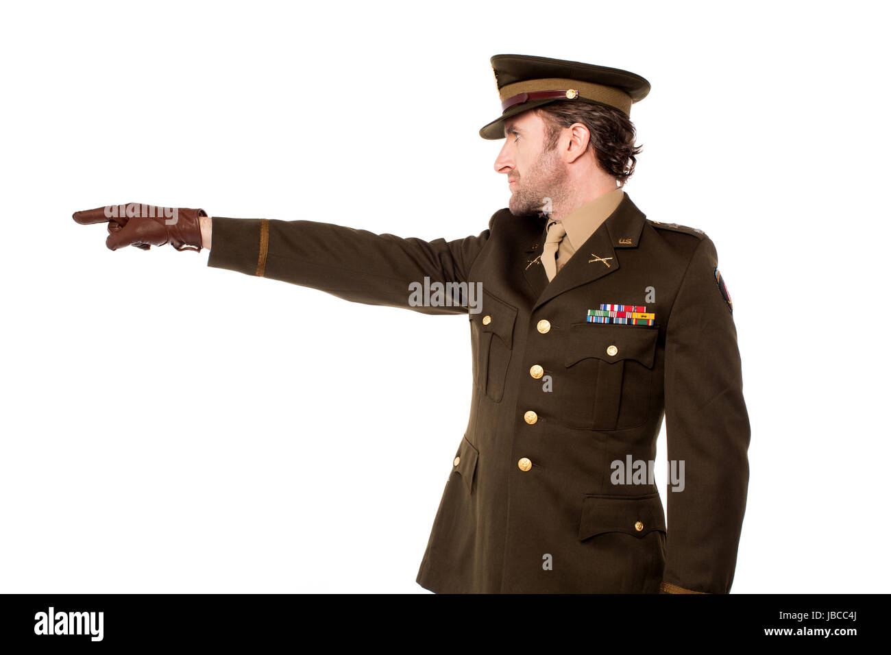 Young american soldier pointing and looking away Stock Photo - Alamy