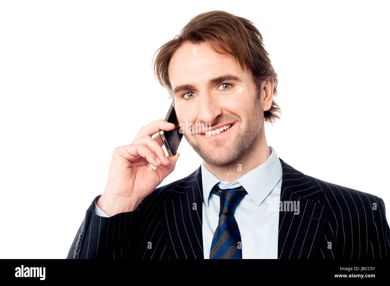 Young professional communicating through cellphone Stock Photo - Alamy