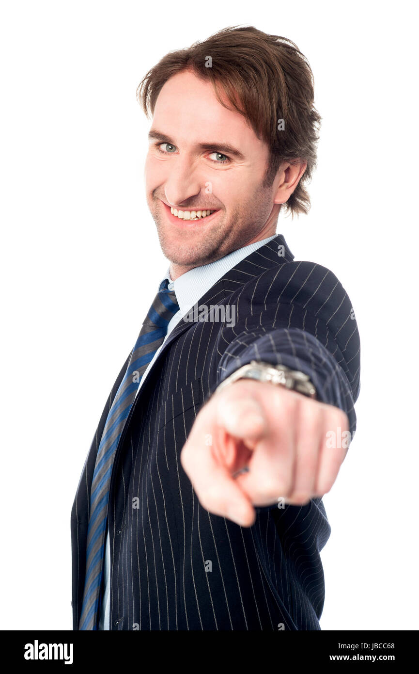 Handsome smiling businessman pointing towards you Stock Photo - Alamy