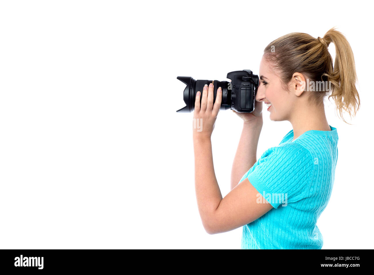 Female photographer focusing to capture the moment Stock Photo - Alamy