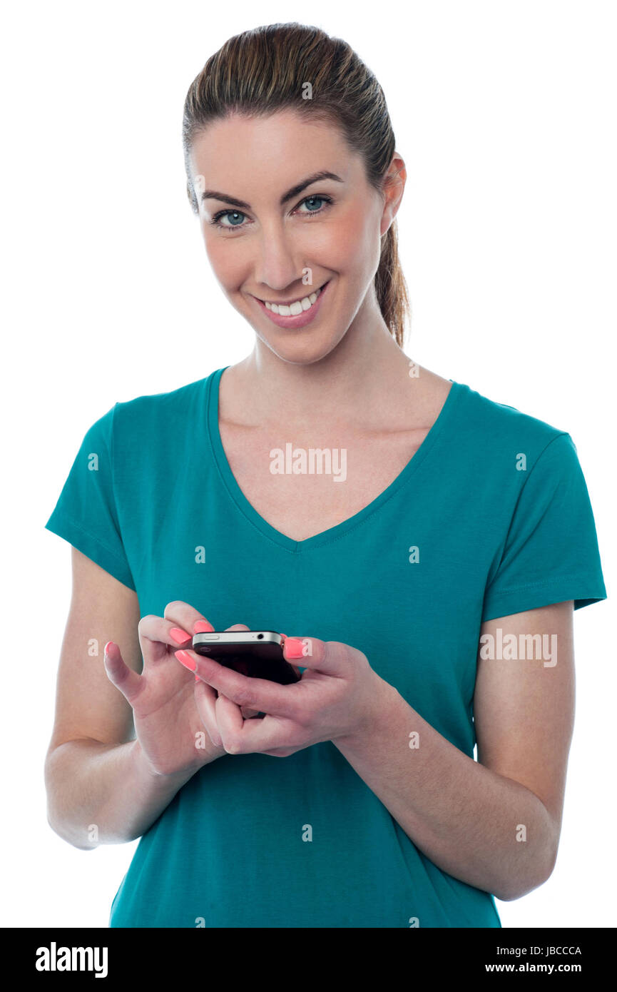 Woman sending text message to her friend Stock Photo - Alamy