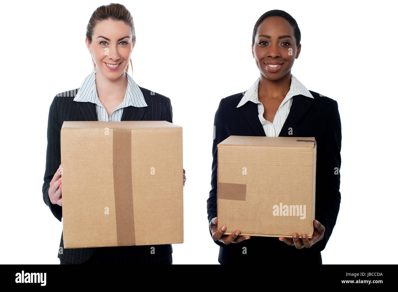 Female executives holding cardboard boxes Stock Photo - Alamy