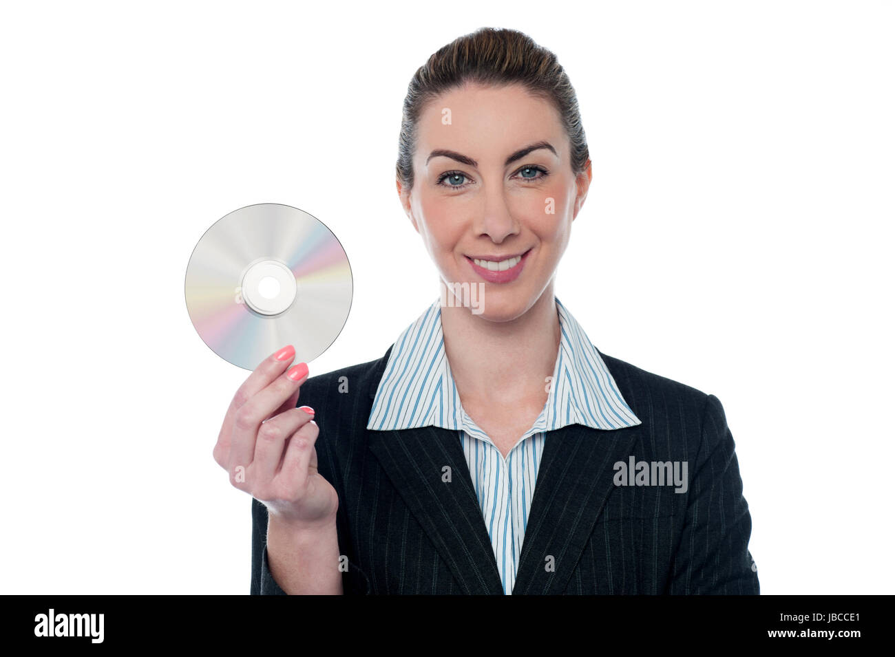 Young smiling businesswoman showing CD Stock Photo - Alamy