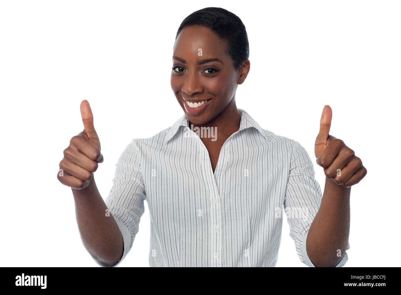 Corporate woman gesturing thumbs up Stock Photo - Alamy