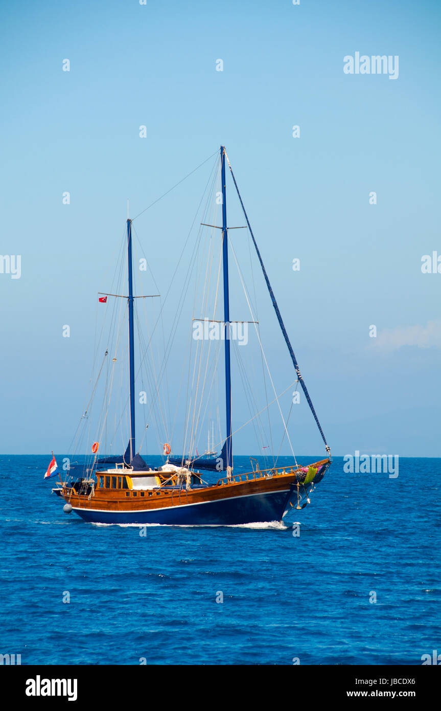 A ship with the sails down on the sea horizon Stock Photo - Alamy