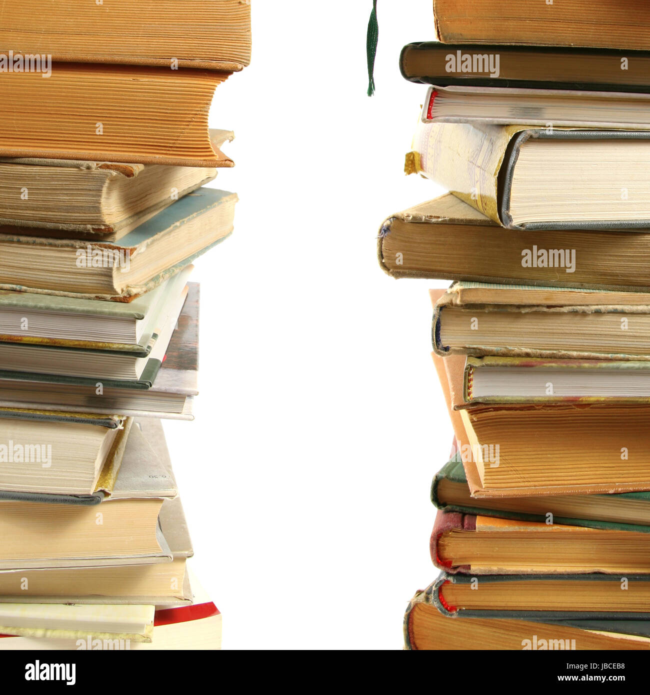 Stack of dusty books on white background hi-res stock photography and ...