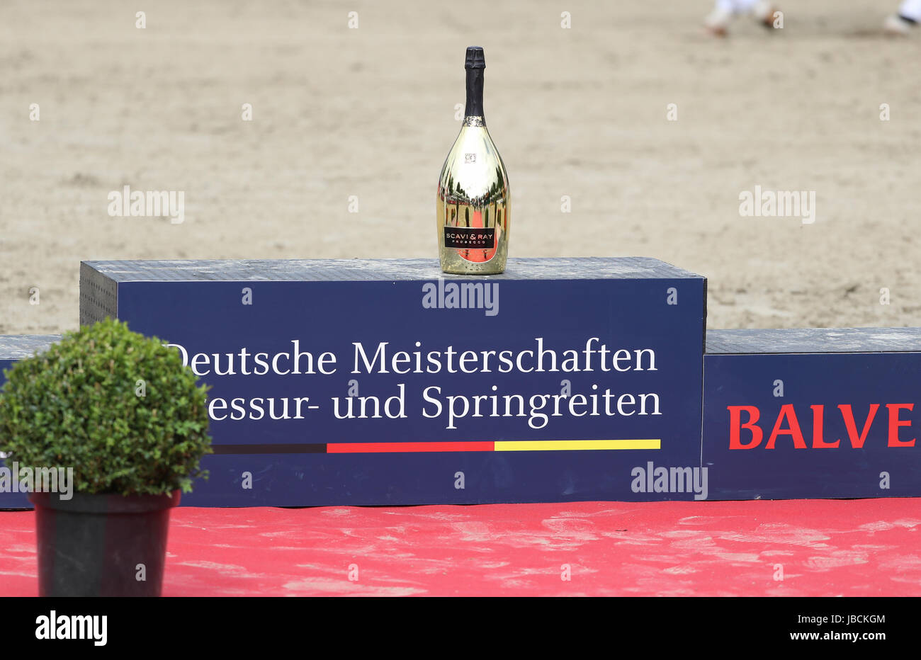 A bottle of prosecco on the podium after the victory ceremony for the ...