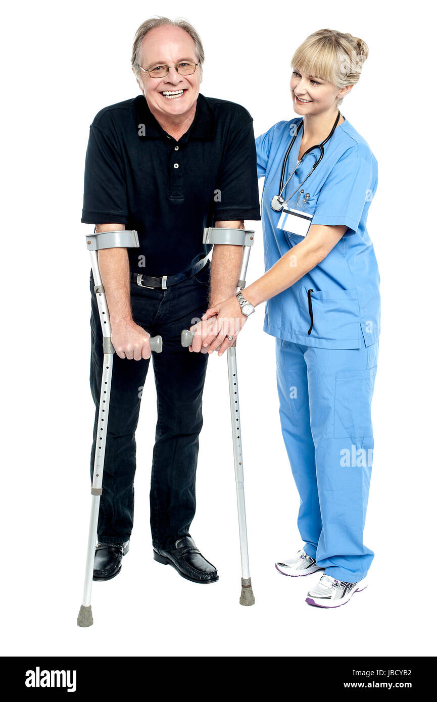 Experienced physician assisting her patient in recovery process ...