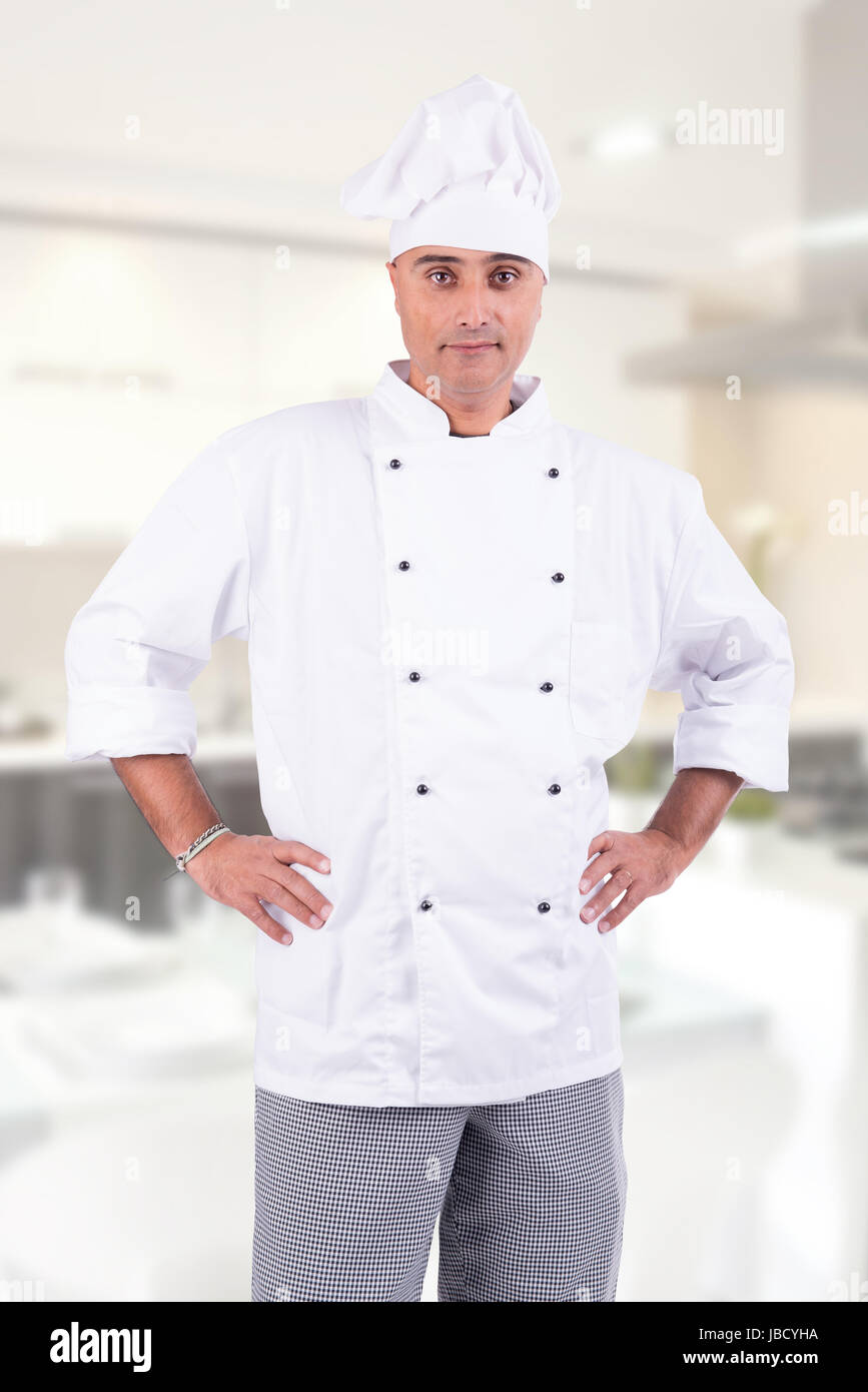 Male chef posing in the kitchen Stock Photo - Alamy