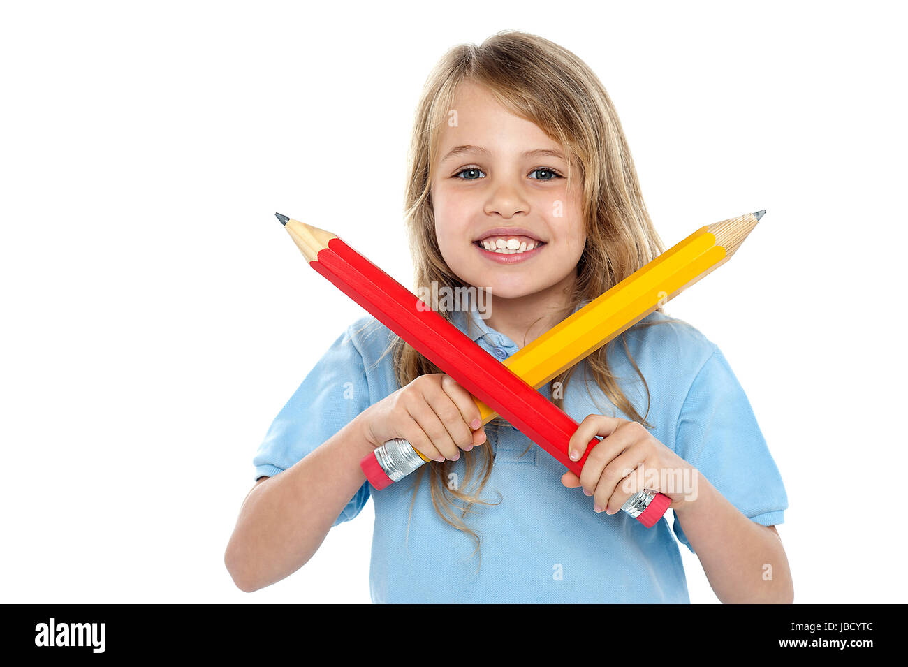 Pretty young primary child holding her pencils crisscross, white ...