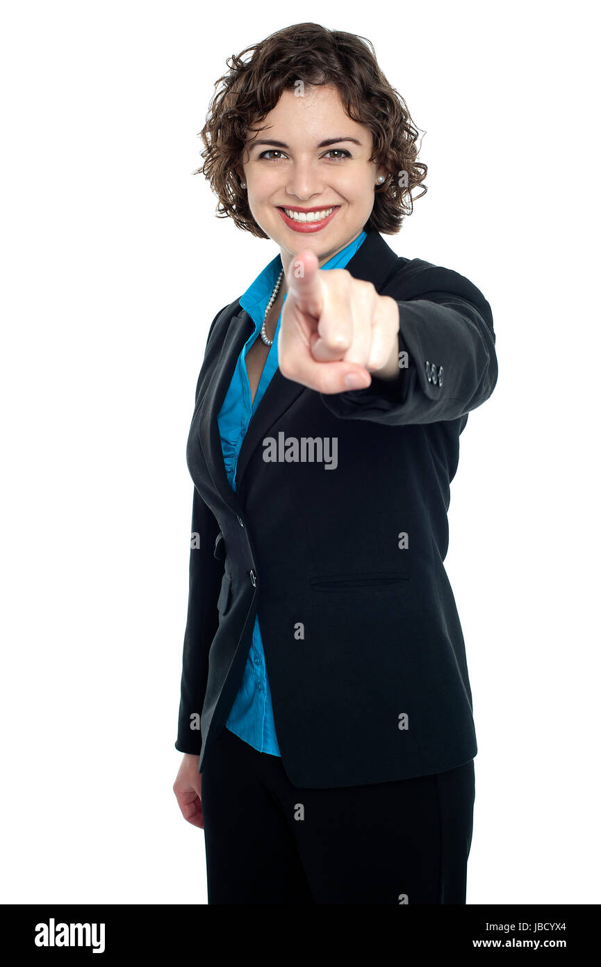 Professional female executive pointing towards hi-res stock photography ...