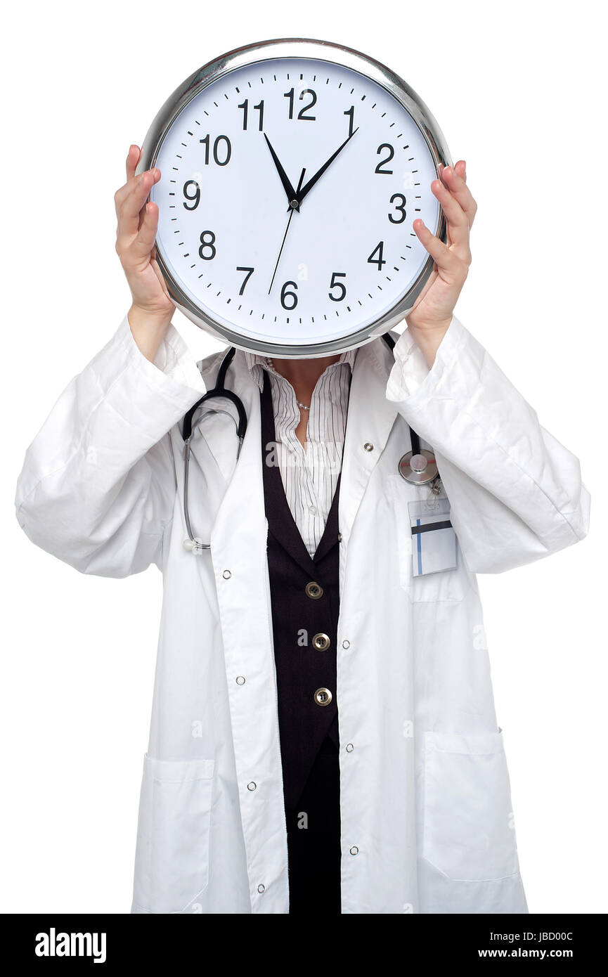 Shot of medical professional holding up wall clock before her face ...