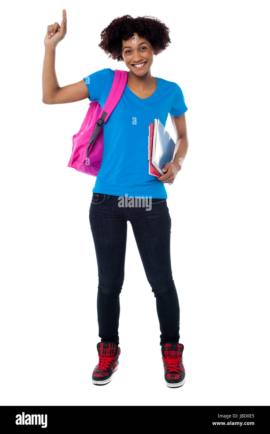 Full length portrait of smiling university student raising her hand ...