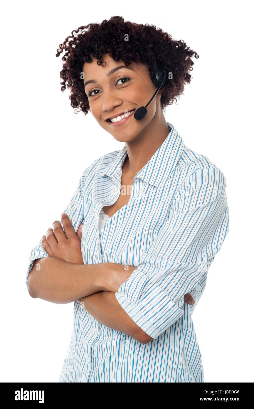 Female telecaller with folded arms striking stylish pose, indoor shot ...