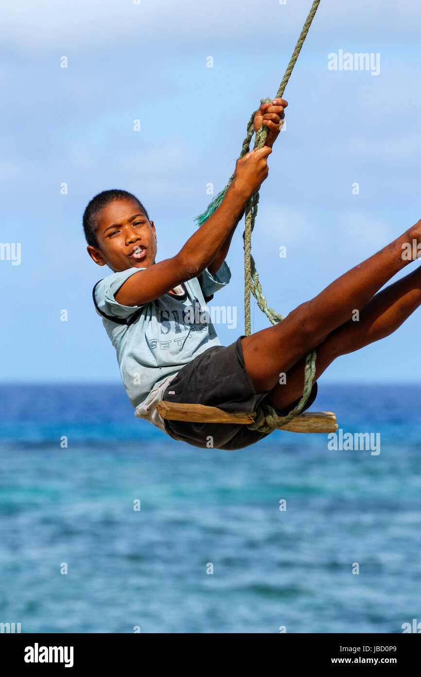 Man swinging on rope hi-res stock photography and images - Alamy