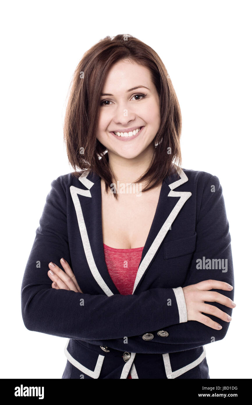 Attractive young woman with a radiant smile, arms crossed Stock Photo ...