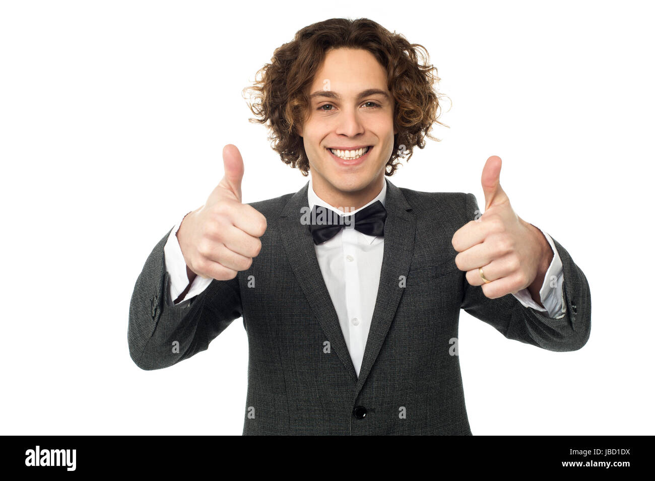 Happy young man in formals showing thumbs up sign with both hands Stock ...
