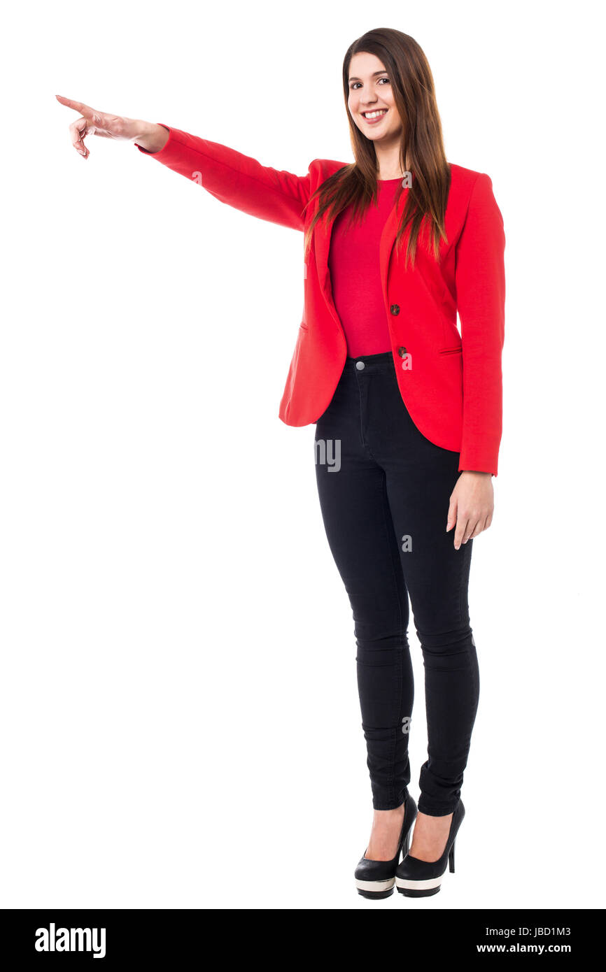 Full length portrait of a young female pointing towards different ...