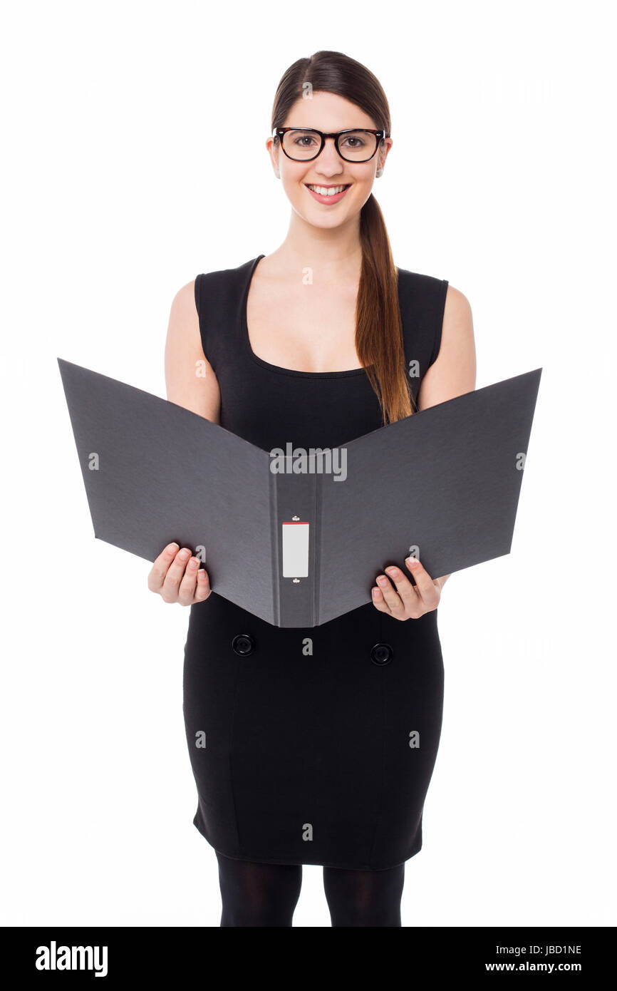 Bespectacled businesswoman reviewing company's past record Stock Photo ...