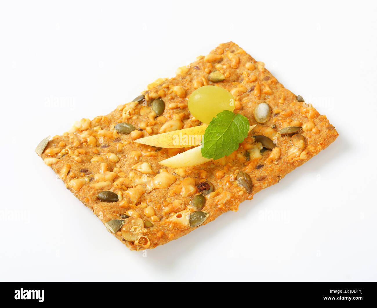 Whole grain cracker with cheddar and pepitas Stock Photo - Alamy