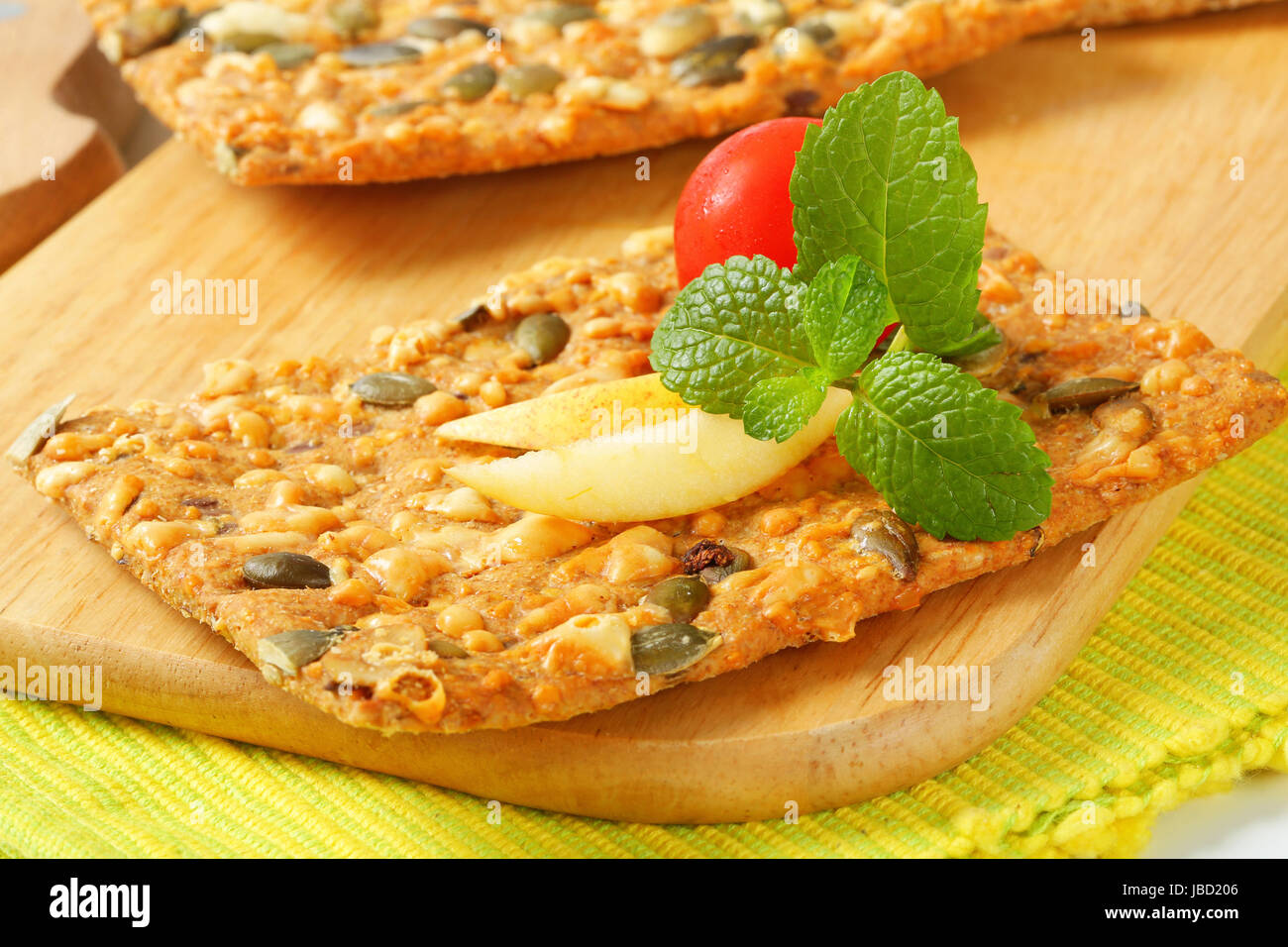 Whole grain cracker with cheddar and pepitas Stock Photo - Alamy