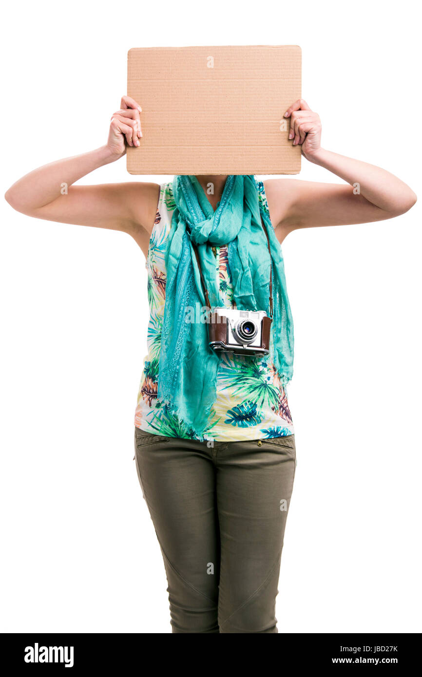 Beautiful woman holding a cardboard, isolated over a white background ...