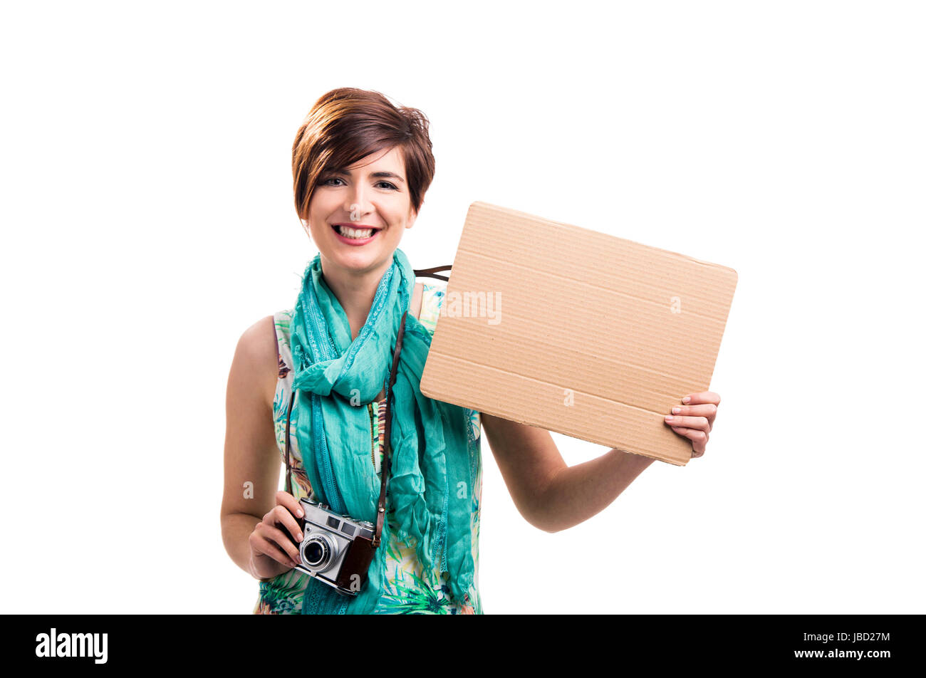 Beautiful woman holding a cardboard, isolated over a white background ...