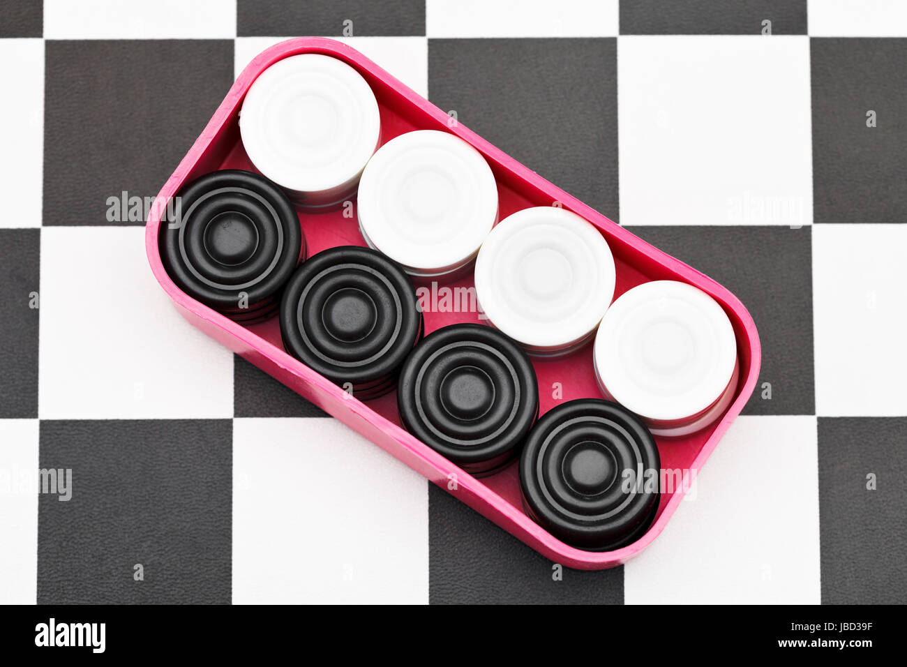 box with checkers on black and white checkerboard Stock Photo - Alamy