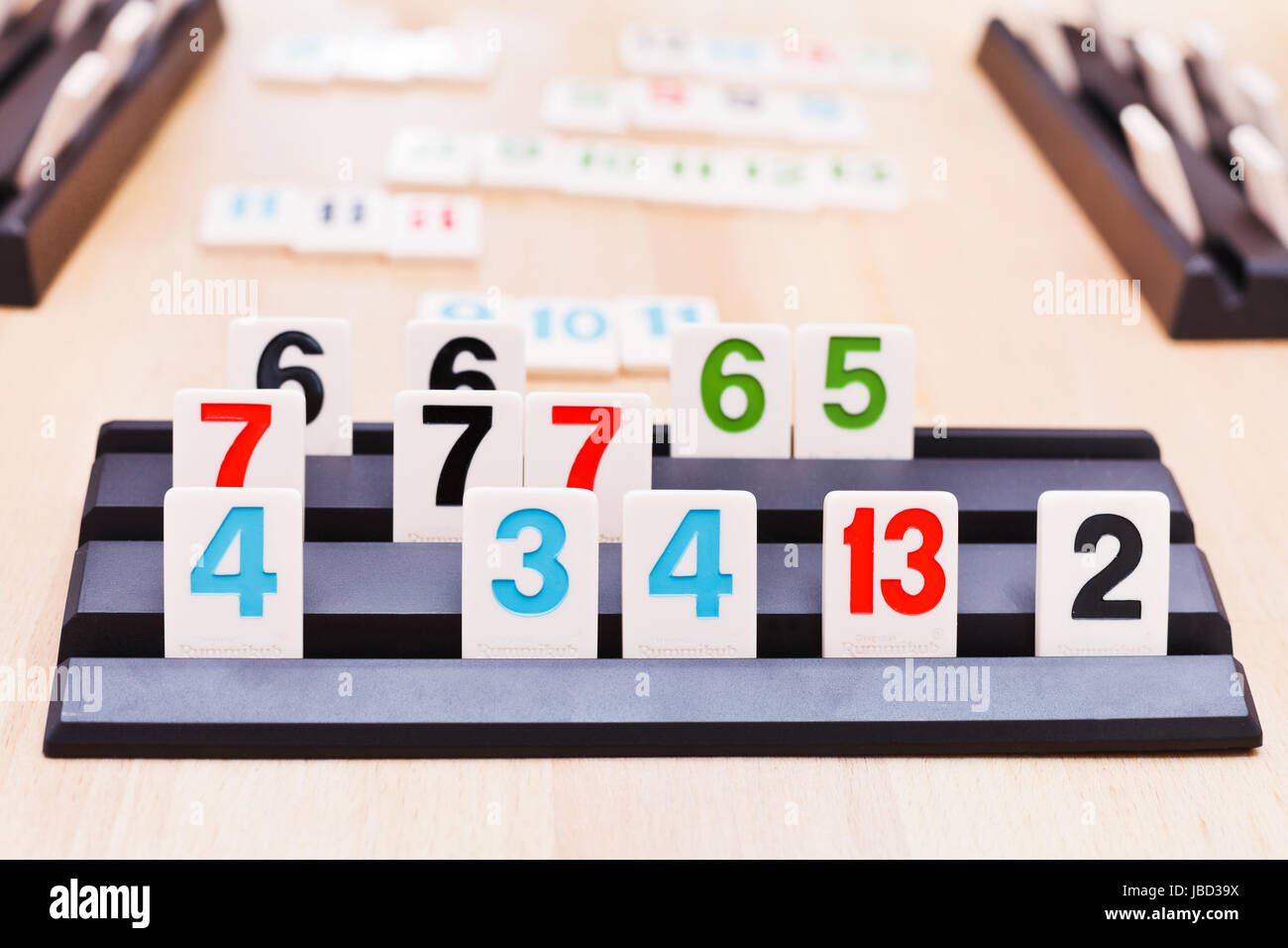 MOSCOW, RUSSIA - MARCH 17, 2014: tile sets in playing rack of Rummikub ...