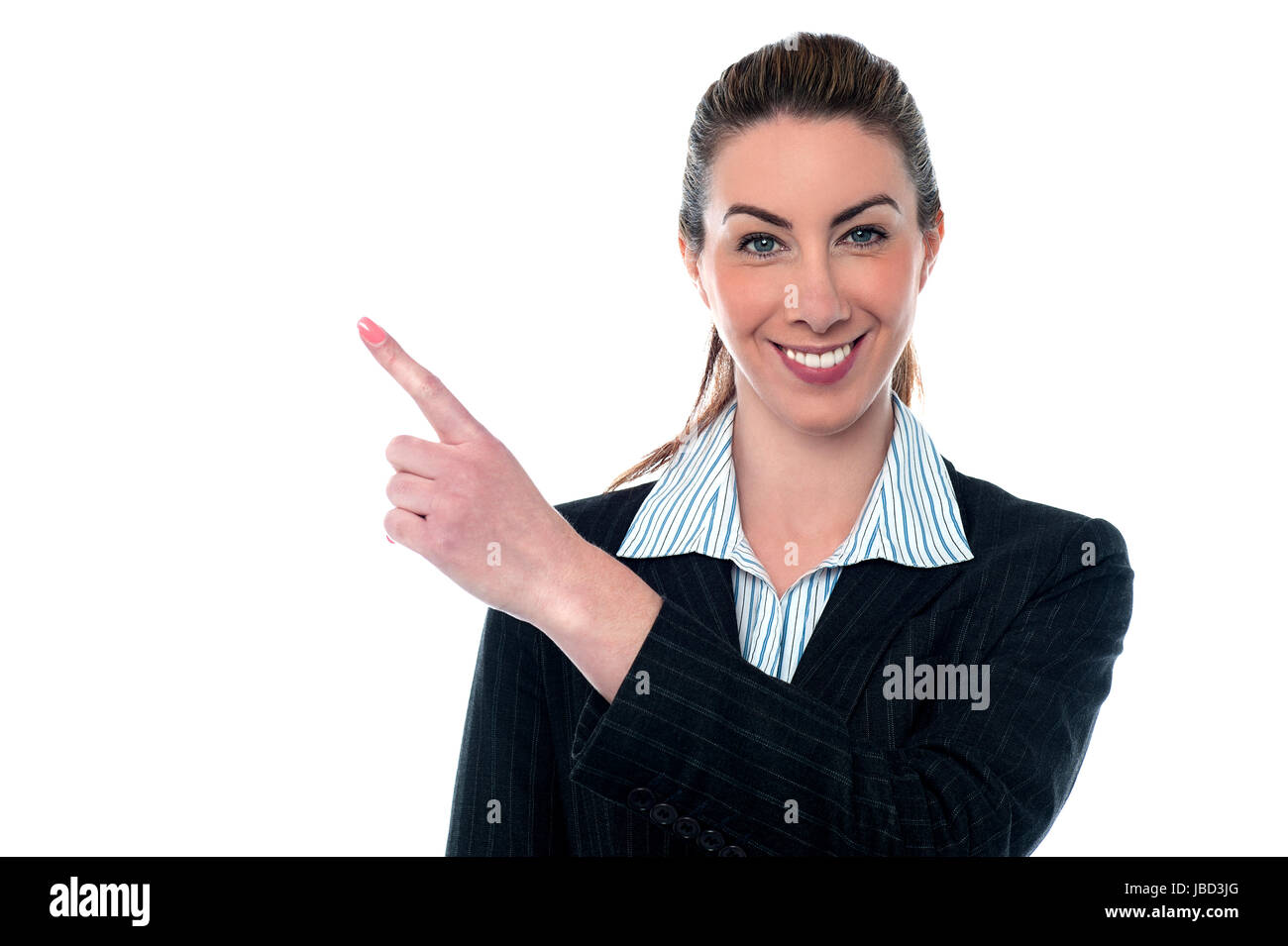 Lady pointing towards copy space area Stock Photo - Alamy