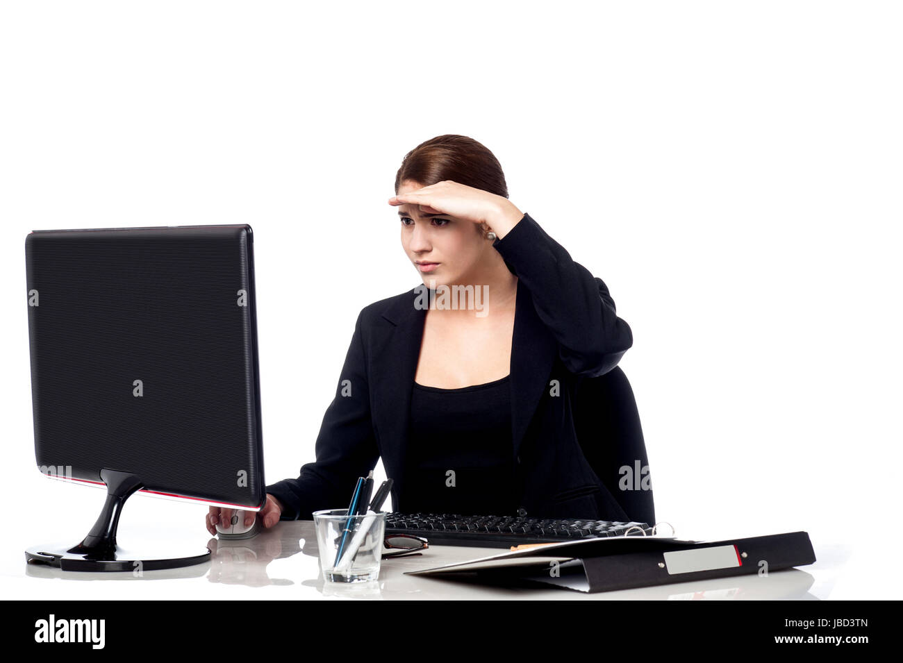 Corporate lady looking into computer screen Stock Photo - Alamy